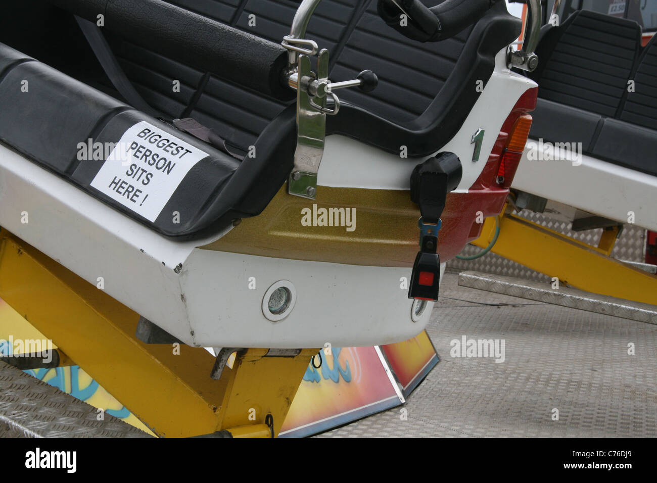 fair ground ride with safety message sign notice Stock Photo - Alamy