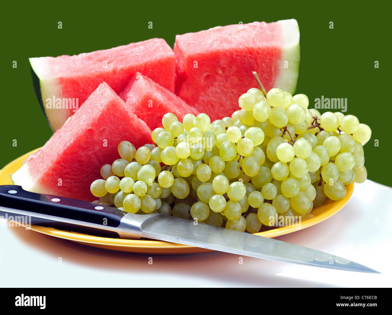 Sweet grape of Champagne vine and red melon Stock Photo - Alamy