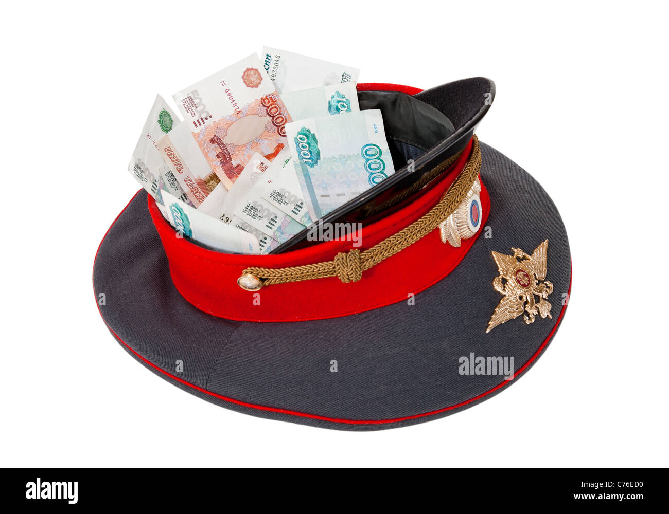 Police cap with money on white background Stock Photo - Alamy