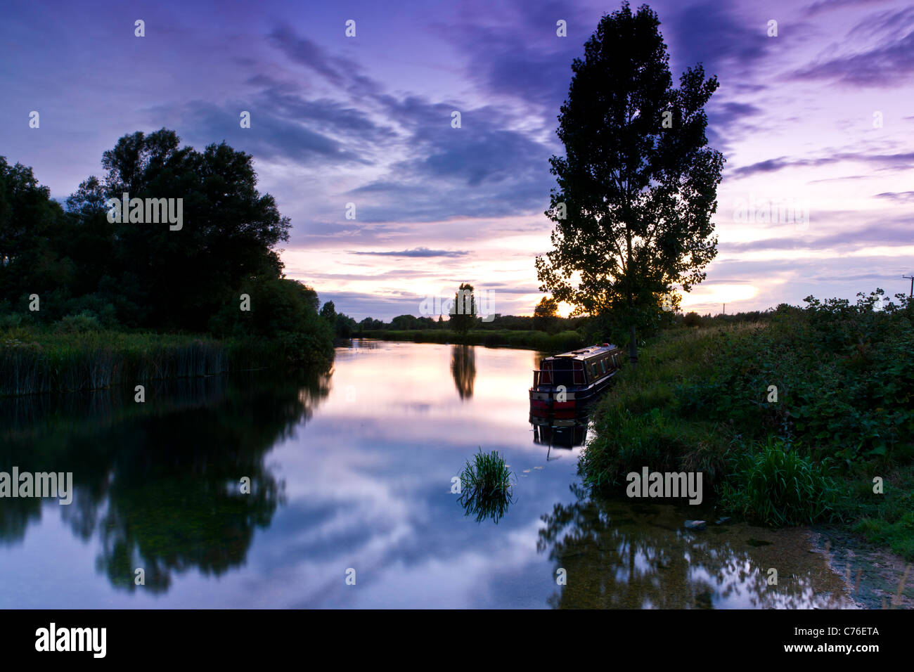 A Narrowboat on the Great Ouse at dusk Stock Photo - Alamy