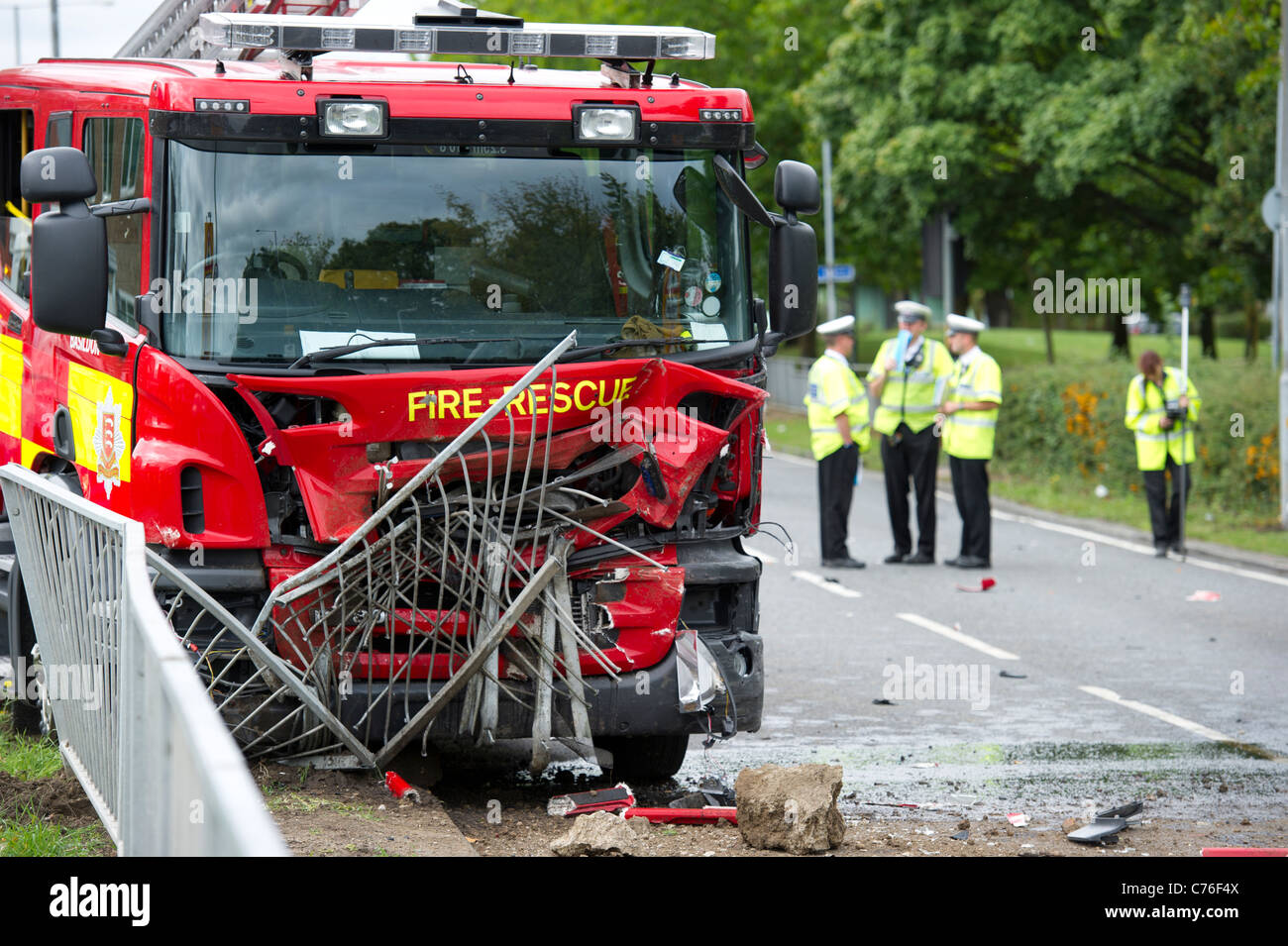 A fire engine with serious damage to the front having been in collision ...