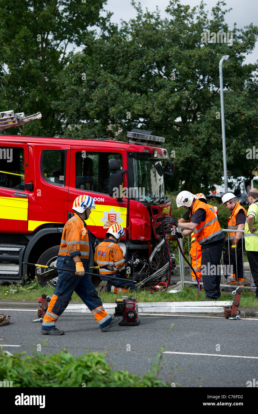 Recovery workers preparing to recover a fire engine for forensic ...