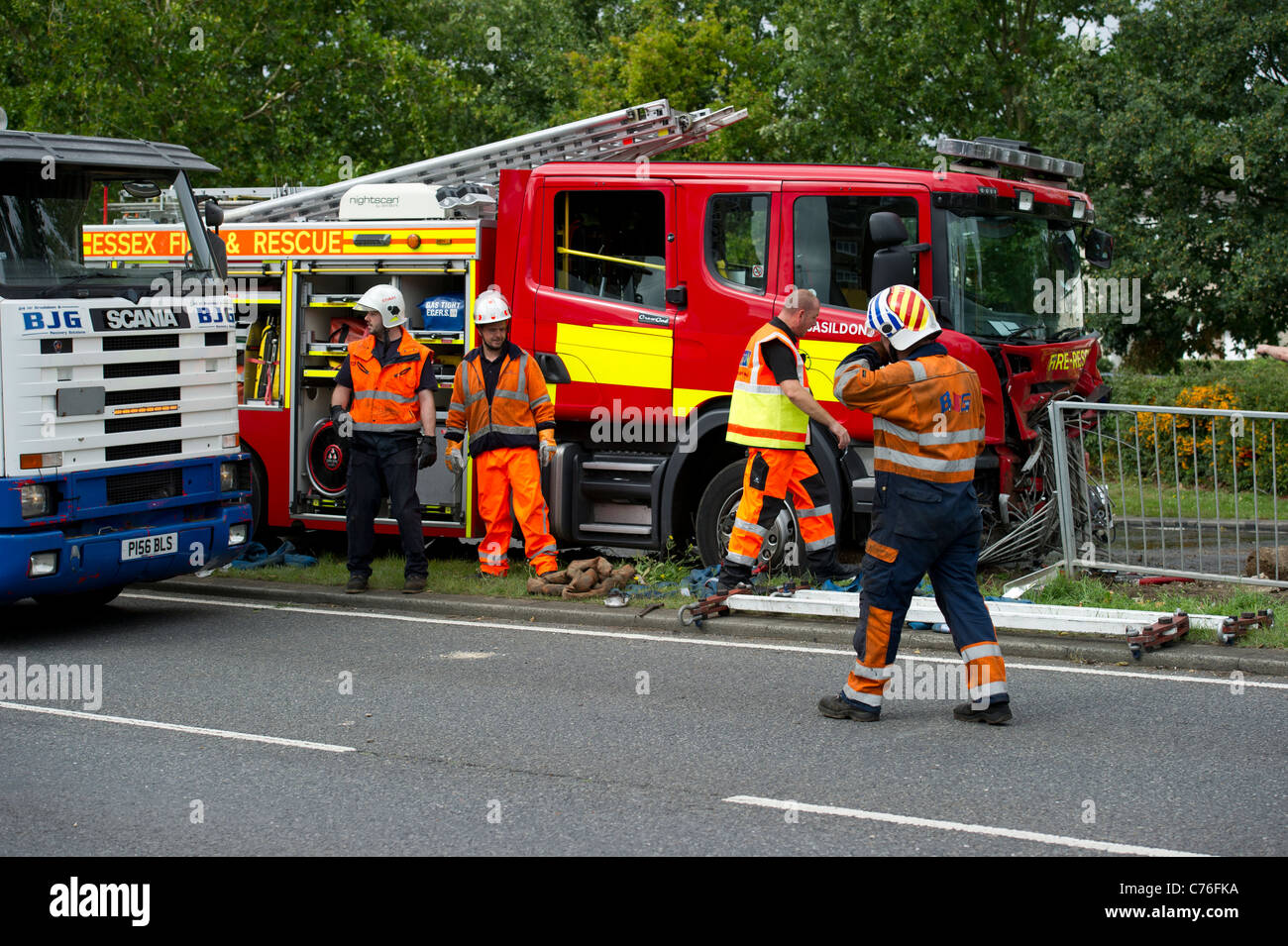 Recovery workers preparing to recover a fire engine for forensic ...