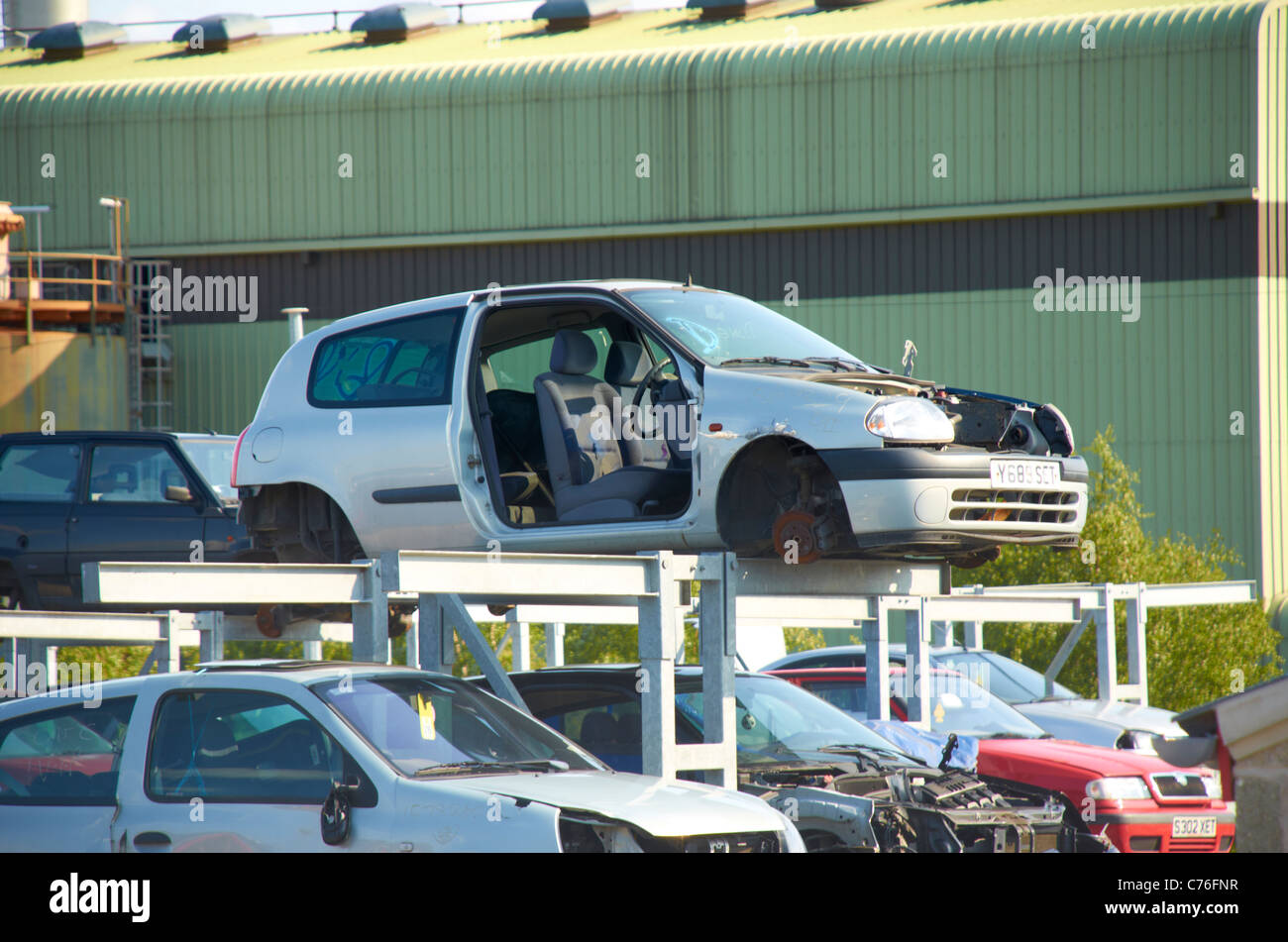 Cars stacked up in a scrapyard Stock Photo - Alamy