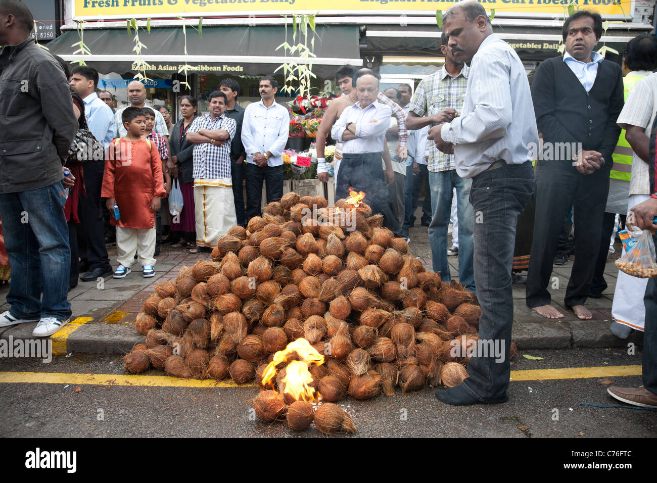 Coconut smashing during thaipusam festival High Resolution Stock ...
