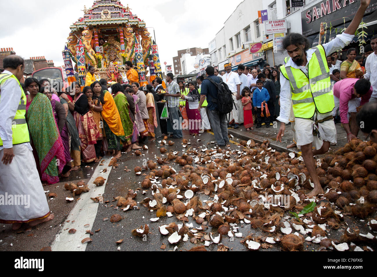 Coconut smashing during thaipusam festival hi-res stock photography and ...