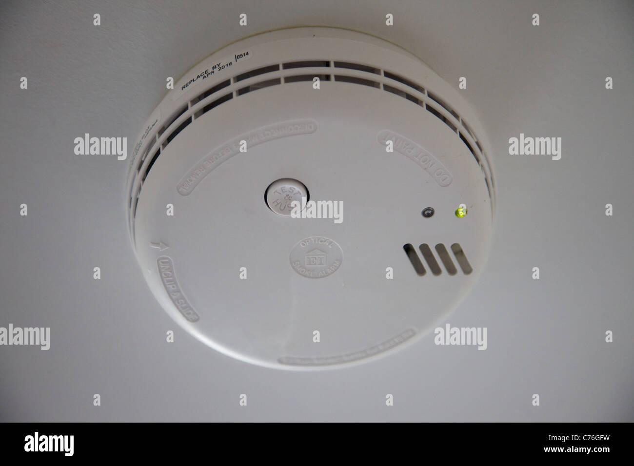Warning mains test button ceiling smoke alarm uk light hi-res stock ...