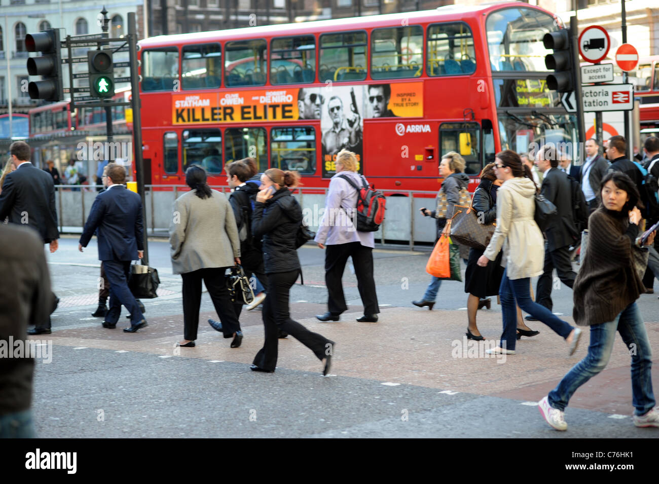 Commuters on way home from work outside Victoria railway station London ...