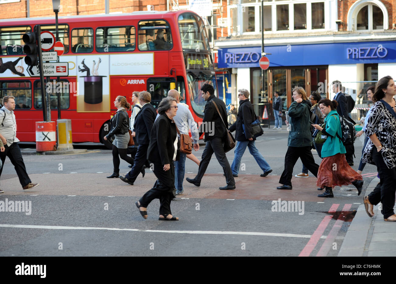 Commuters on way home from work outside Victoria railway station London ...