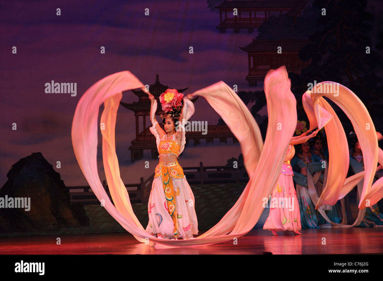 Two female dancers performing a ribbon dance at Tang dynasty dinner ...
