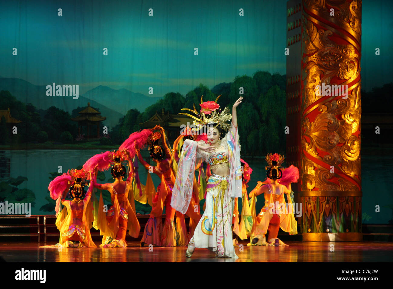 Lead dancer with bird headdress and six other dancers performing at ...