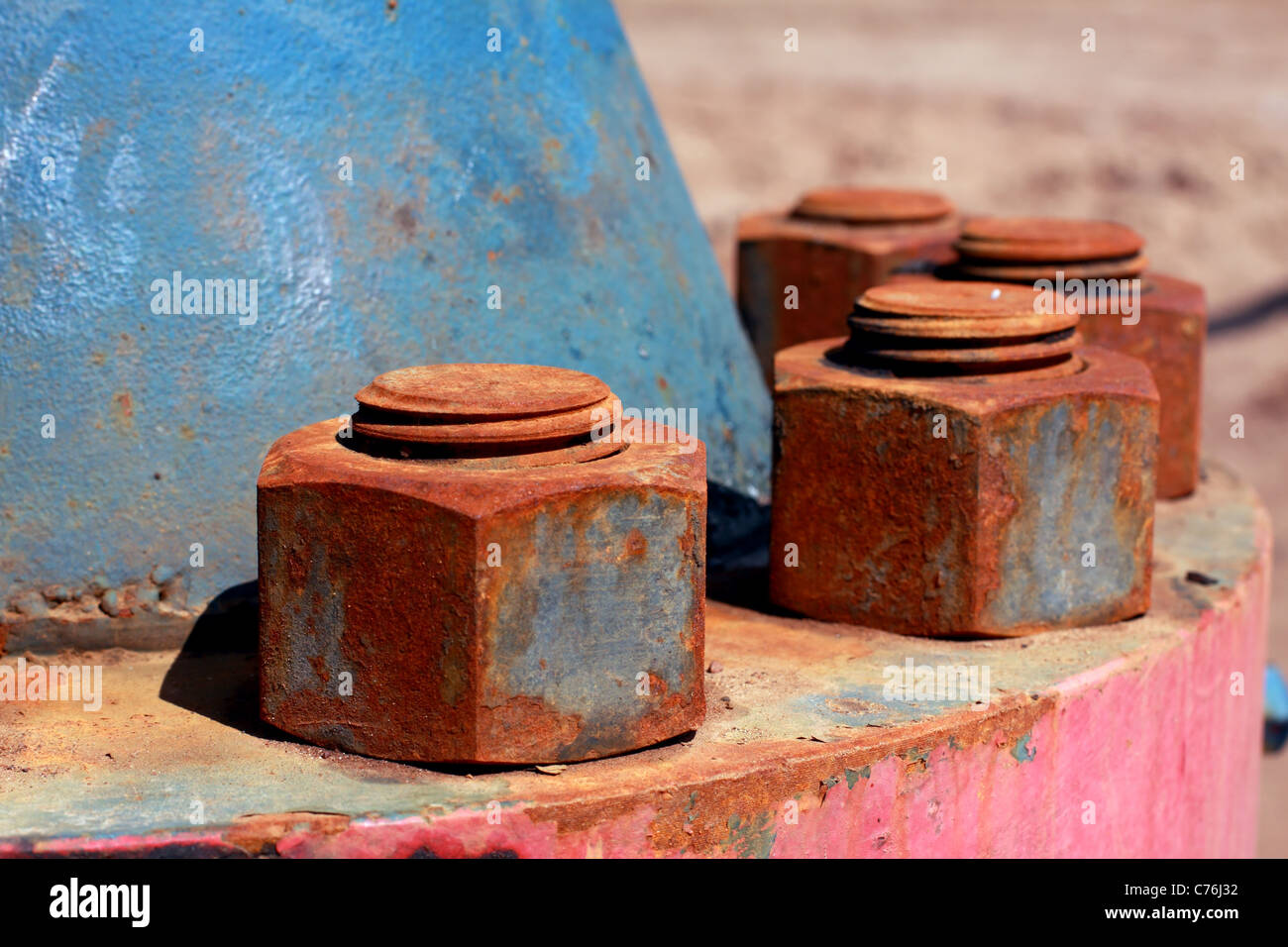 Rusty large nuts on wellhead Stock Photo - Alamy