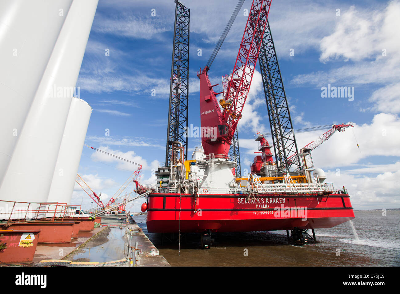A jack up barge being loaded with wind turbine parts for the Walney ...