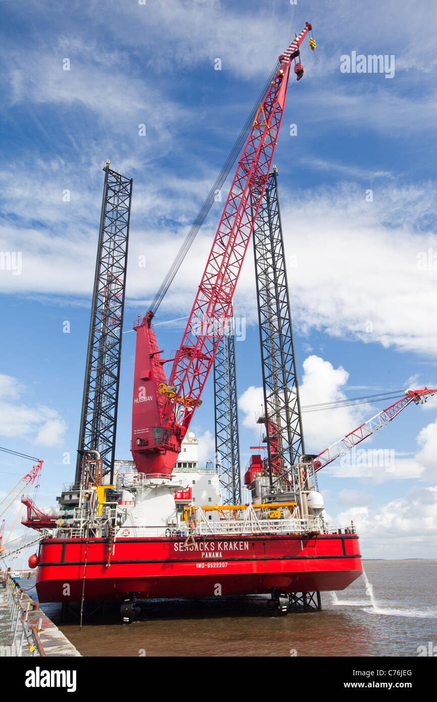 A jack up barge being loaded with wind turbine parts for the Walney ...