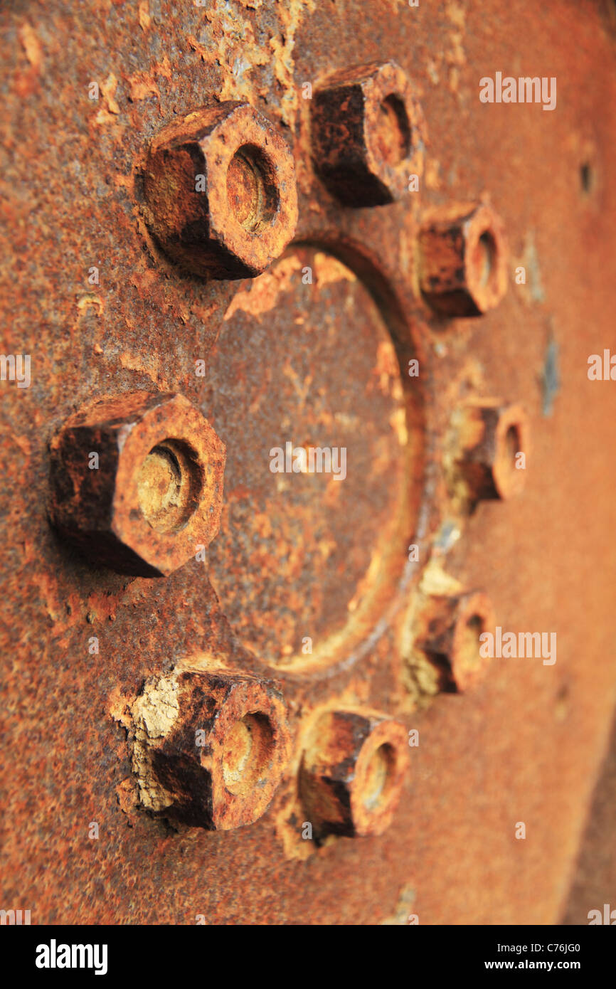 Rusty nuts on an old tractors wheel Stock Photo - Alamy