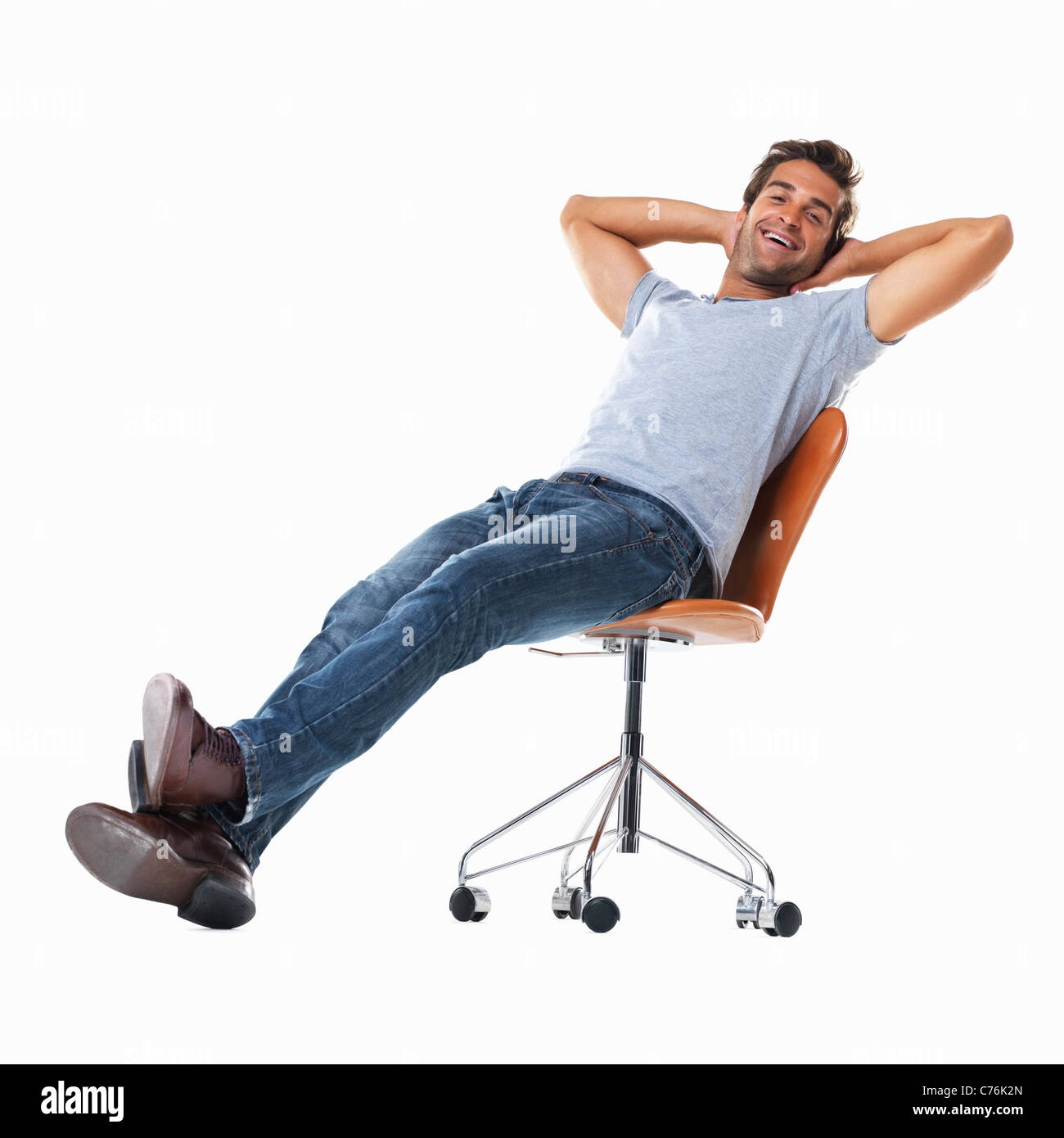 Man sitting on chair behind Cut Out Stock Images & Pictures - Alamy