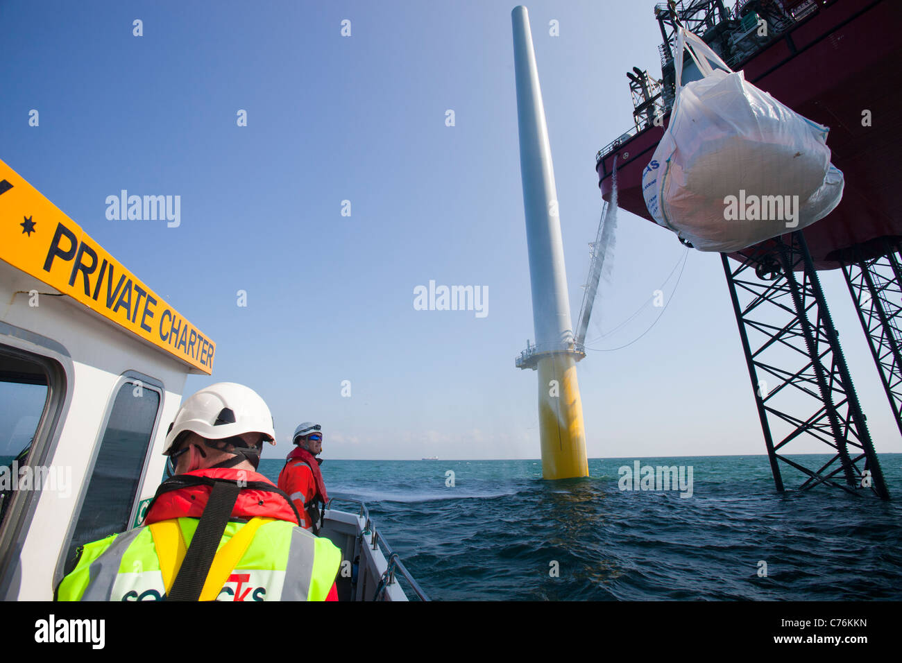 A jack up barge constructing the Walney offshore wind farm, Cumbria, UK ...