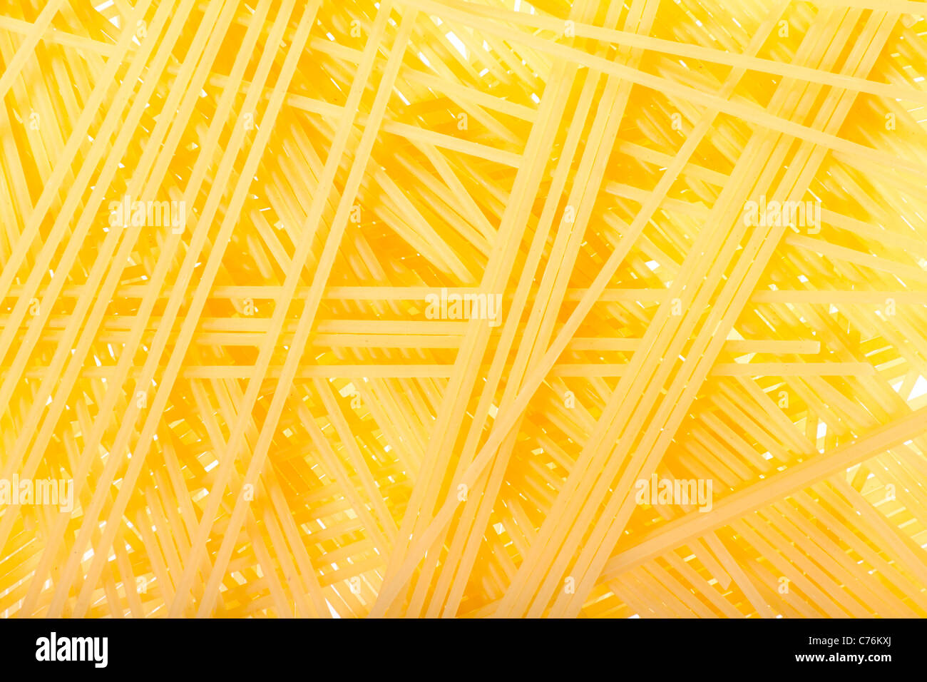 the yellow spaghetti as abstract color background Stock Photo - Alamy