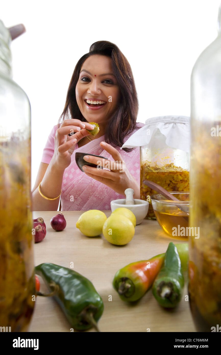 Portrait of a woman holding a pickle Stock Photo - Alamy