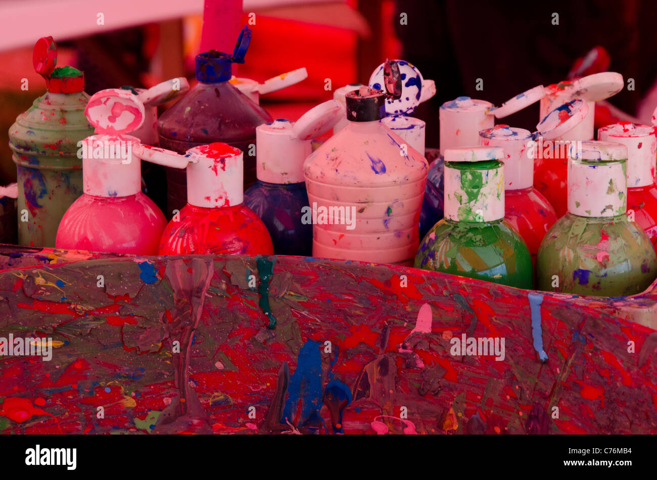messy kids paint containers in a box Stock Photo - Alamy