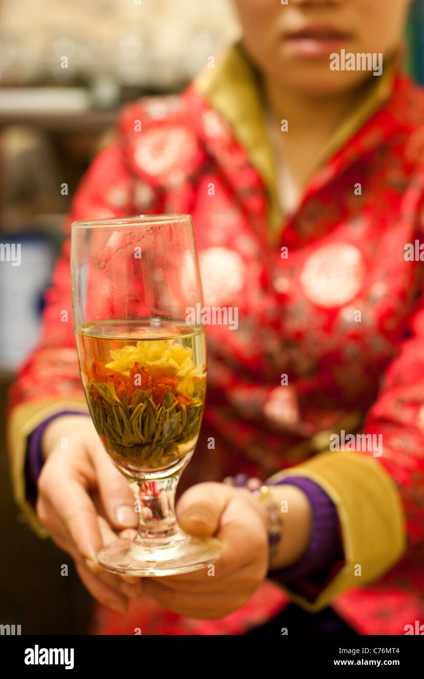 Chinese girl offers exotic tea at tea ceremony Stock Photo - Alamy