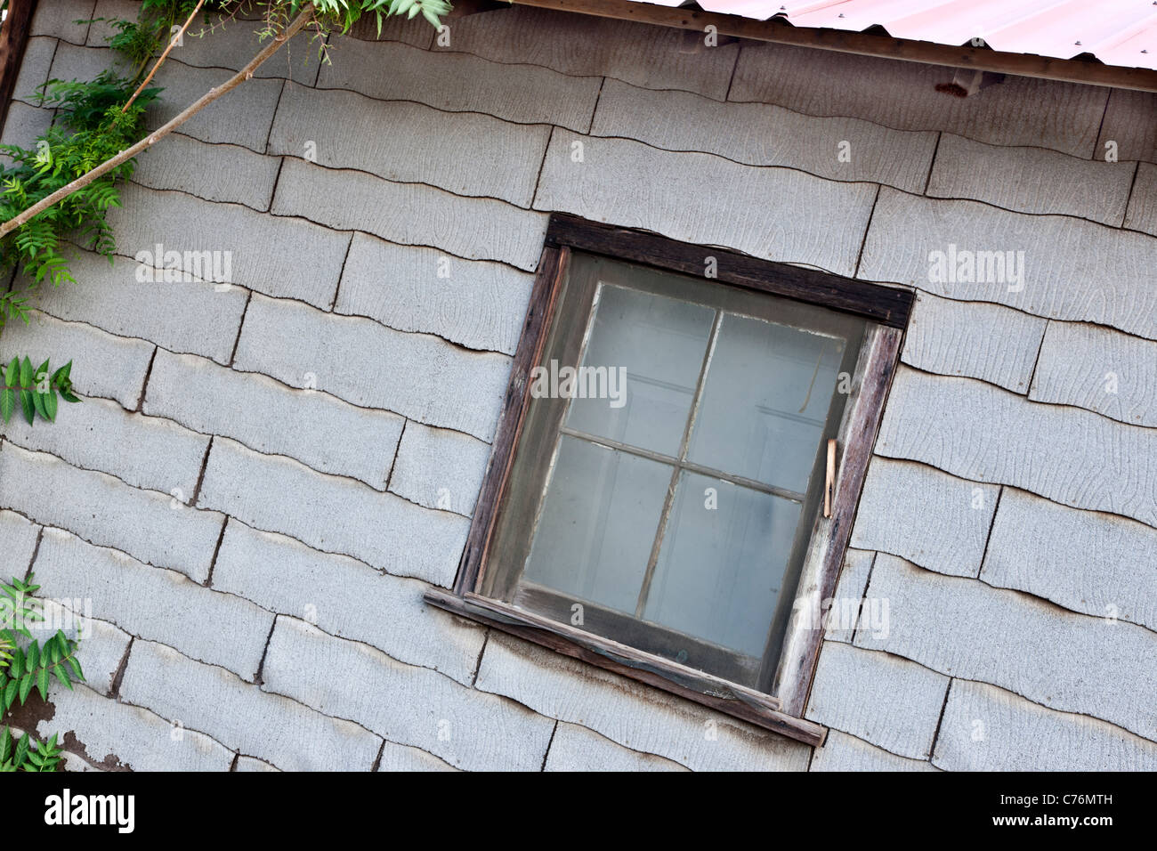 Window, asbestos composition asphalt shingles Stock Photo - Alamy