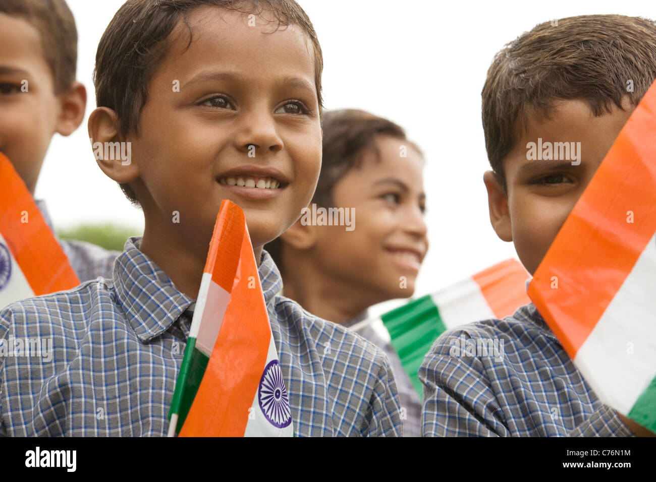 School boys holding the Indian flag Stock Photo - Alamy