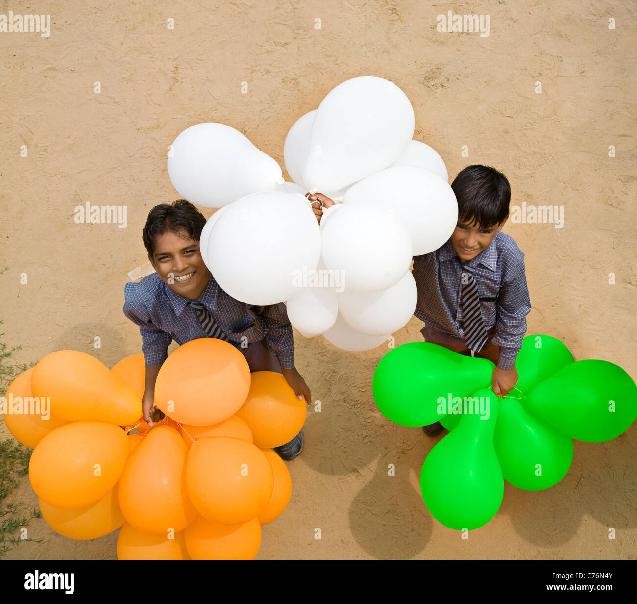 School boys holding tri-colored balloons Stock Photo - Alamy