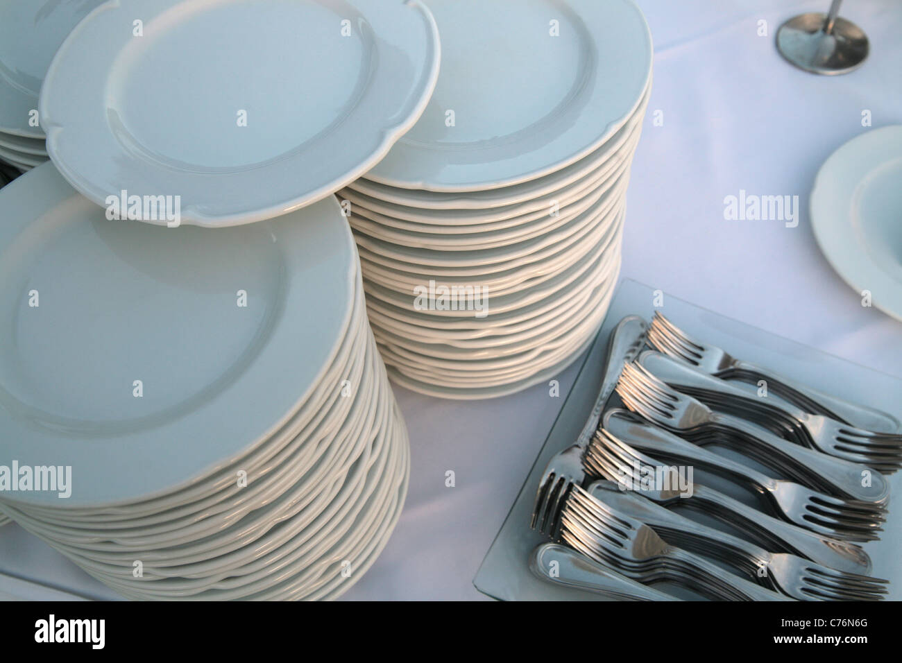 Many forks ready to be used in a banquet outdoors Stock Photo - Alamy