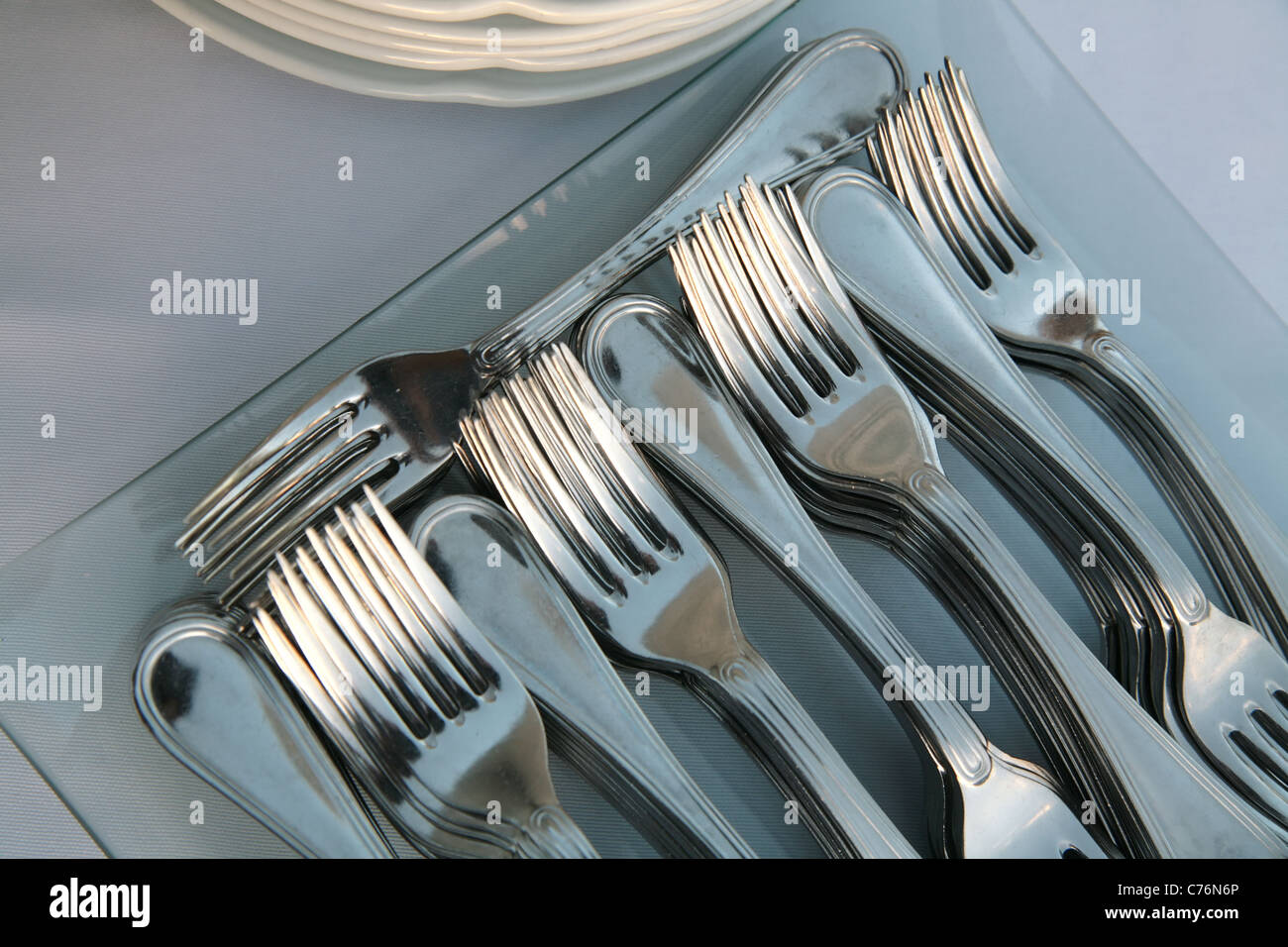 Many forks ready to be used in a banquet outdoors Stock Photo - Alamy