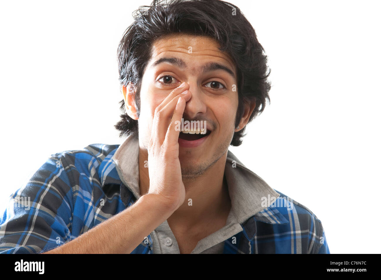 Portrait of a young man cheering Stock Photo - Alamy