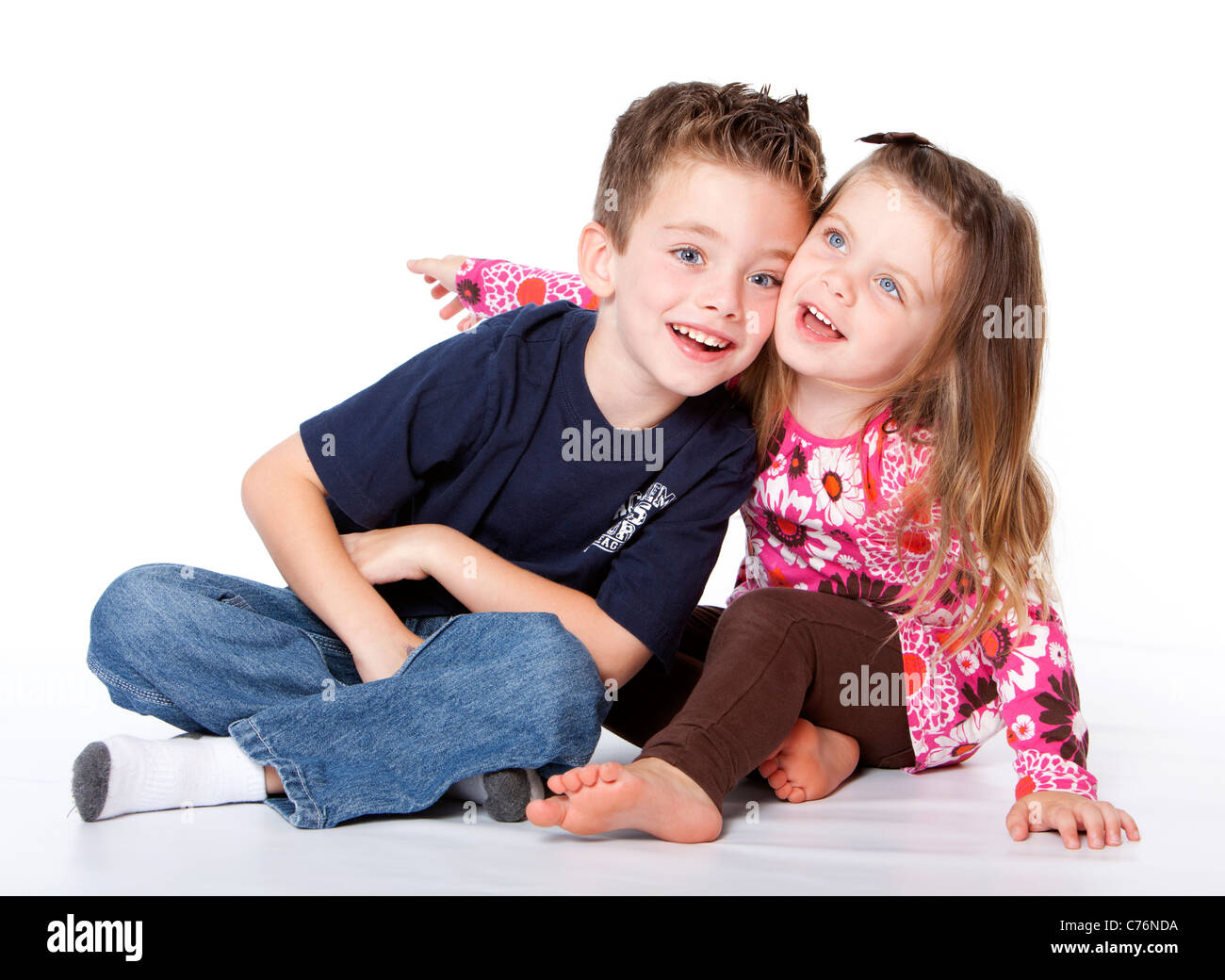Siblings portrait isolated on a white background Stock Photo - Alamy