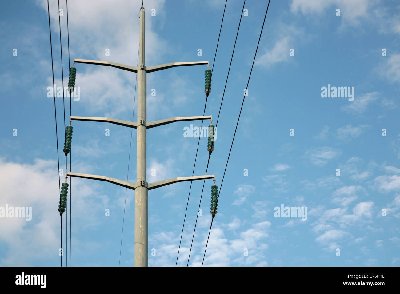 Electrical lines with a post and blue skies Stock Photo - Alamy