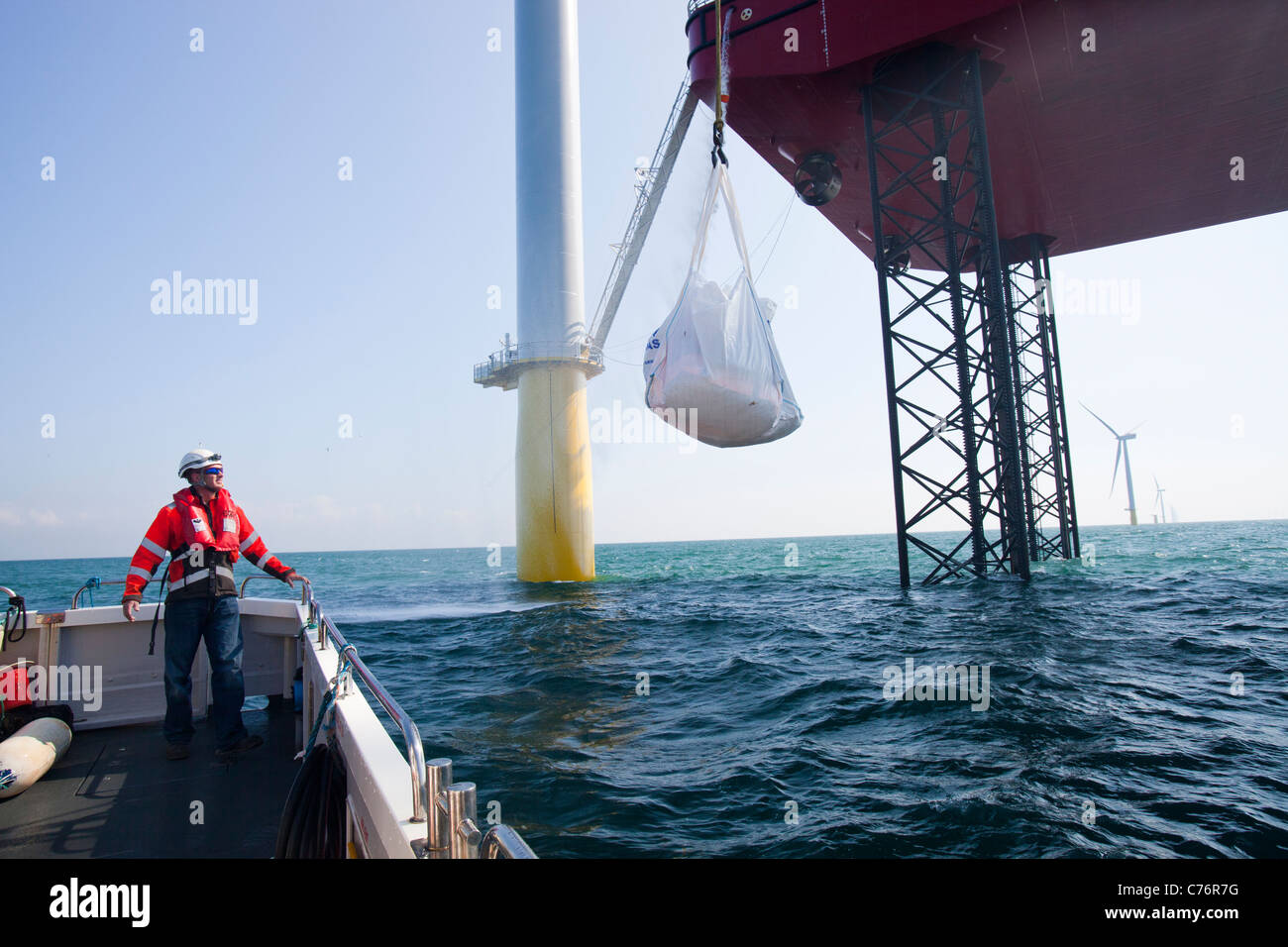 A jack up barge constructing the Walney offshore wind farm, Cumbria, UK ...
