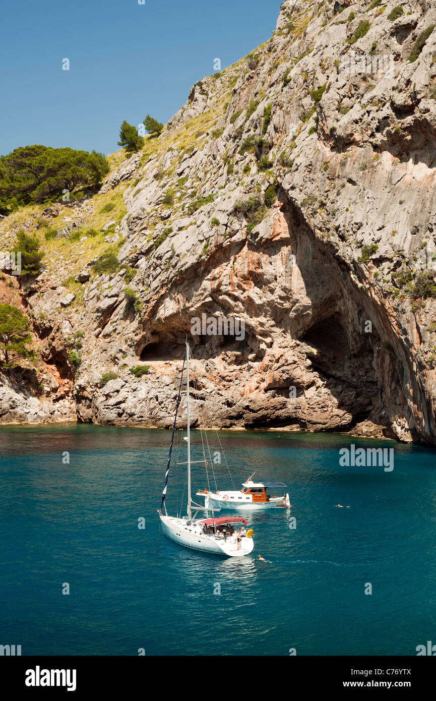 Tourist boats at the entrance to the Torrent de Pareis Gorge, Sa ...