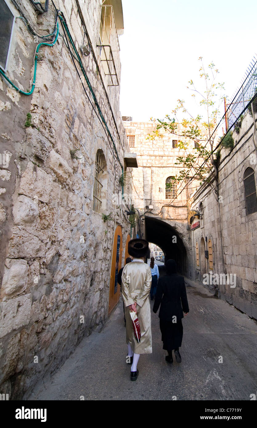 Orthodox Hasidic Jewish couple walking through the Armenian quarter on ...