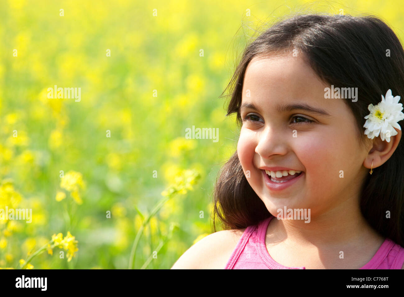 Young girl with a flower in her hair Stock Photo - Alamy