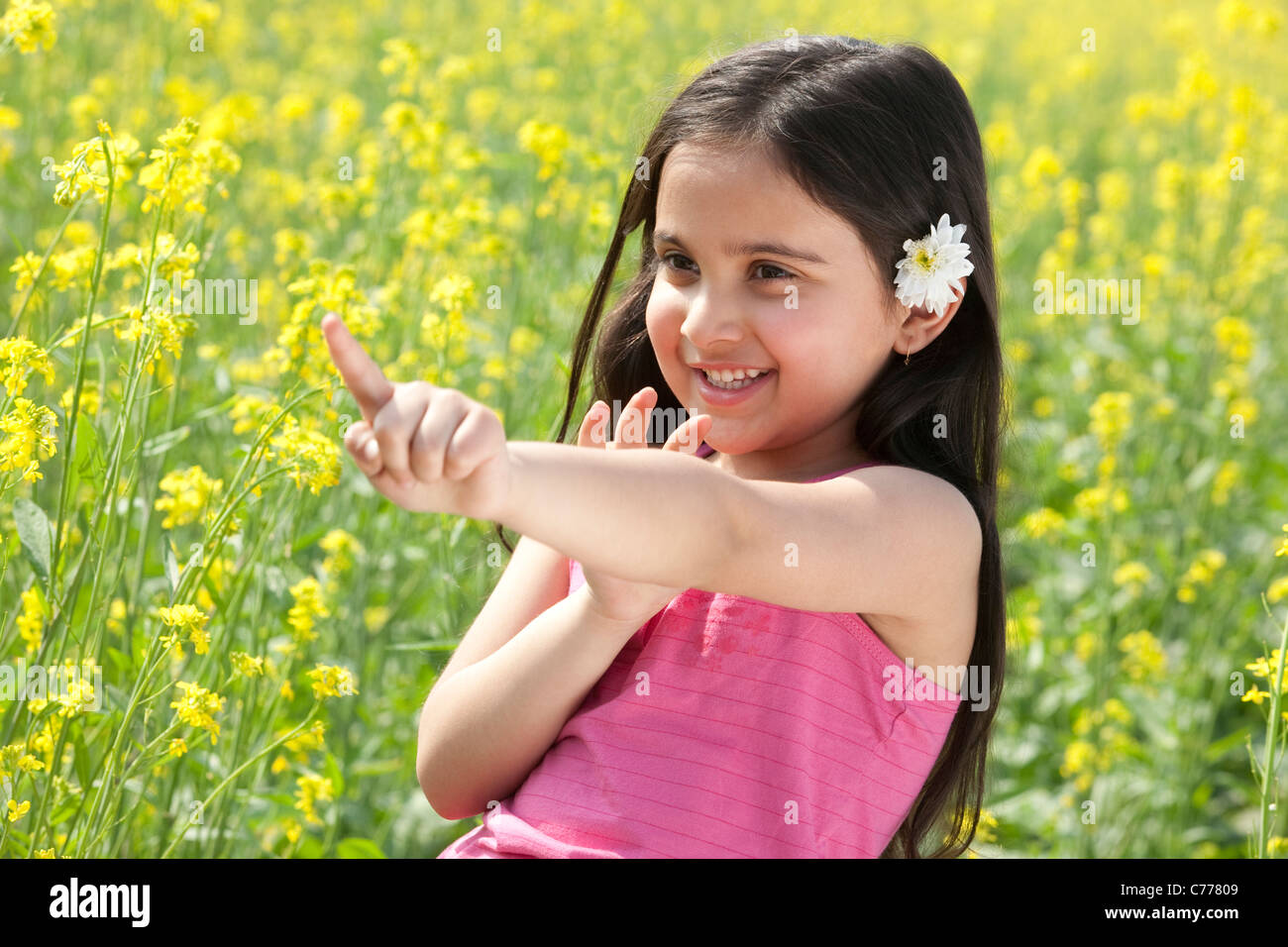 Young girl pointing Stock Photo - Alamy