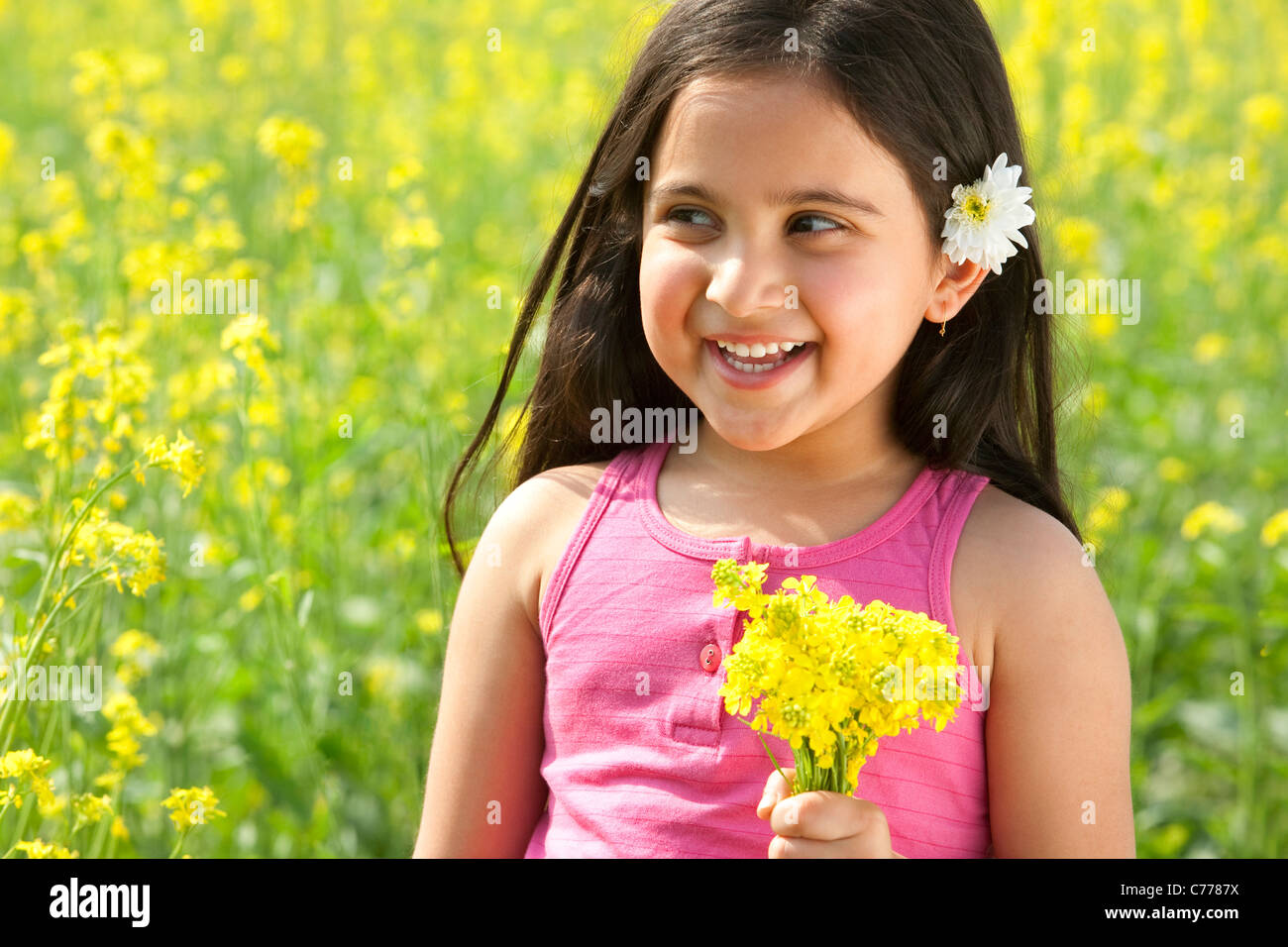 Young girl holding flowers Stock Photo - Alamy Young girl holding flowers Stock Photo - Alamy