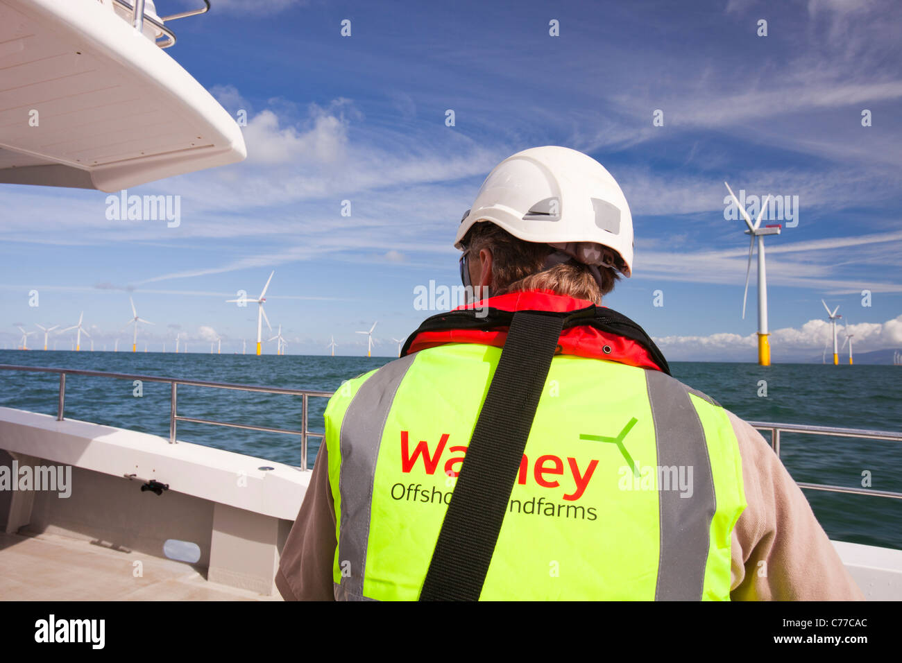 Man climbing wind turbine man wind farm hi-res stock photography and ...