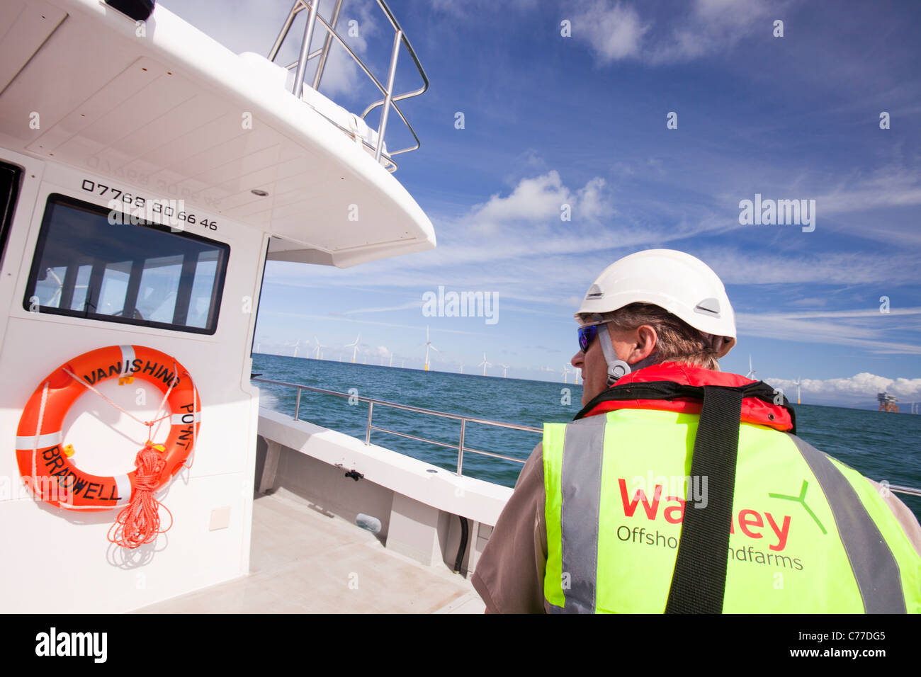 Man climbing wind turbine man wind farm hi-res stock photography and ...