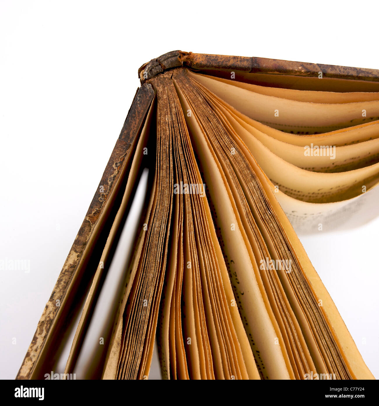 Old book with worn pages and a textured cover resting on a surface ...