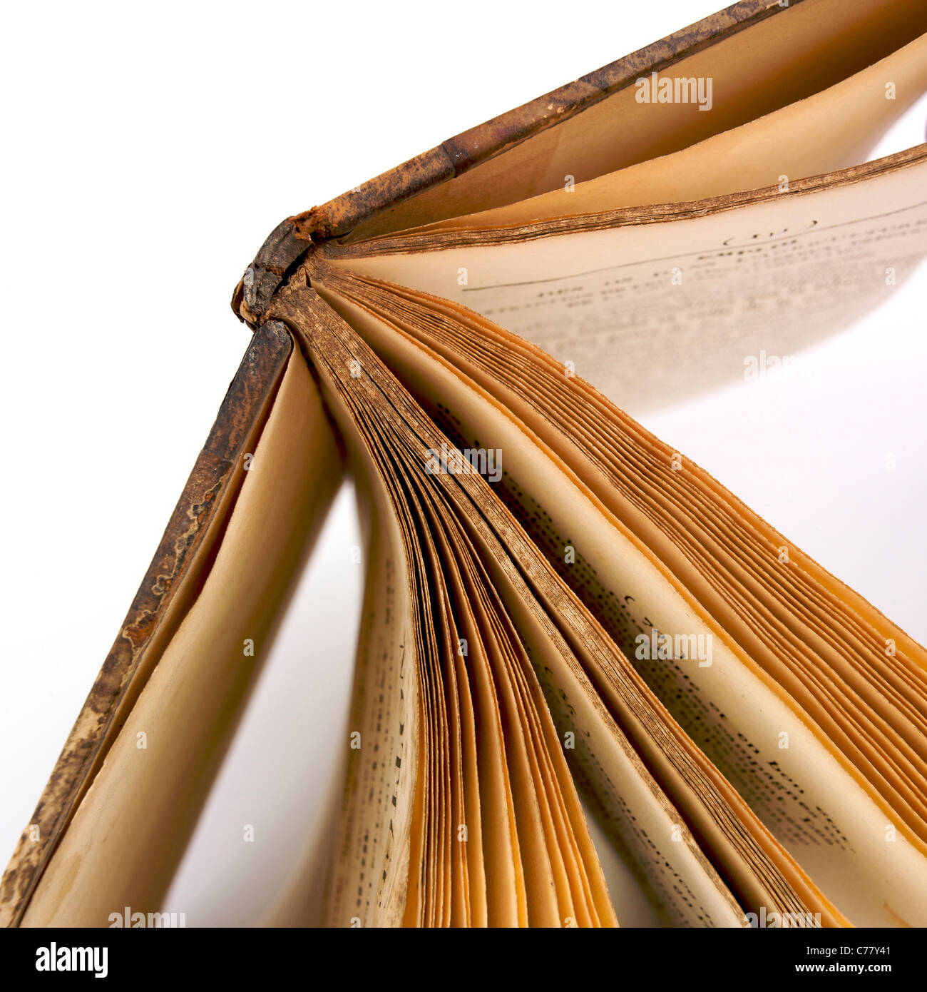Old book with worn pages and a textured cover resting on a surface ...