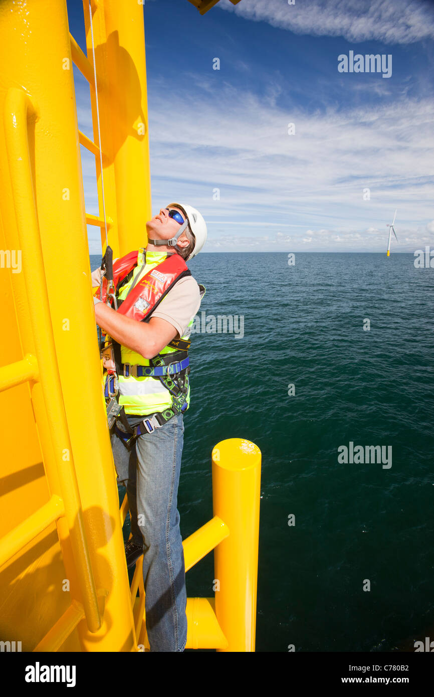 Man climbing wind turbine man wind farm hi-res stock photography and ...