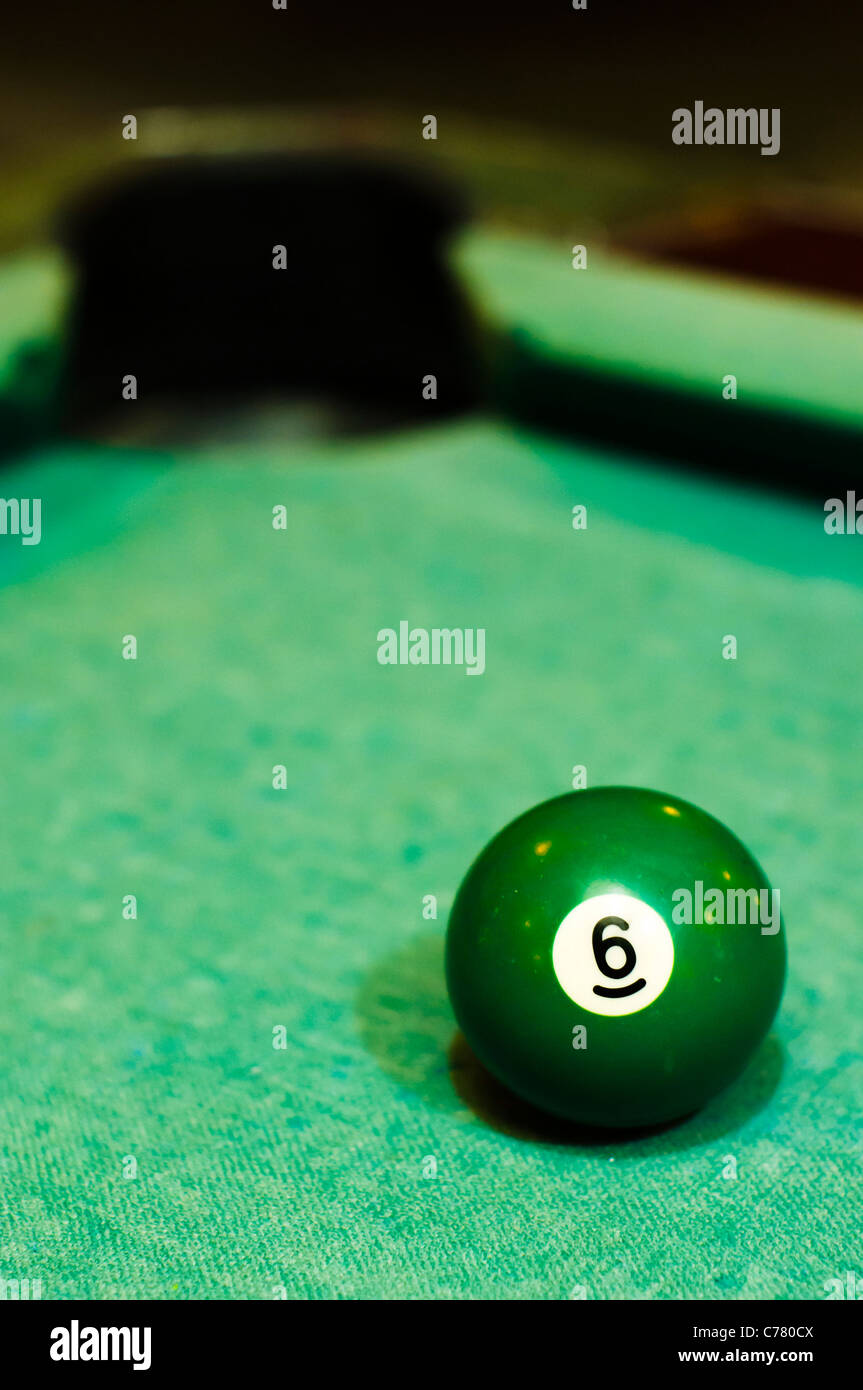 a close up of billiard ball number 6, solid green, for conceptual usage ...