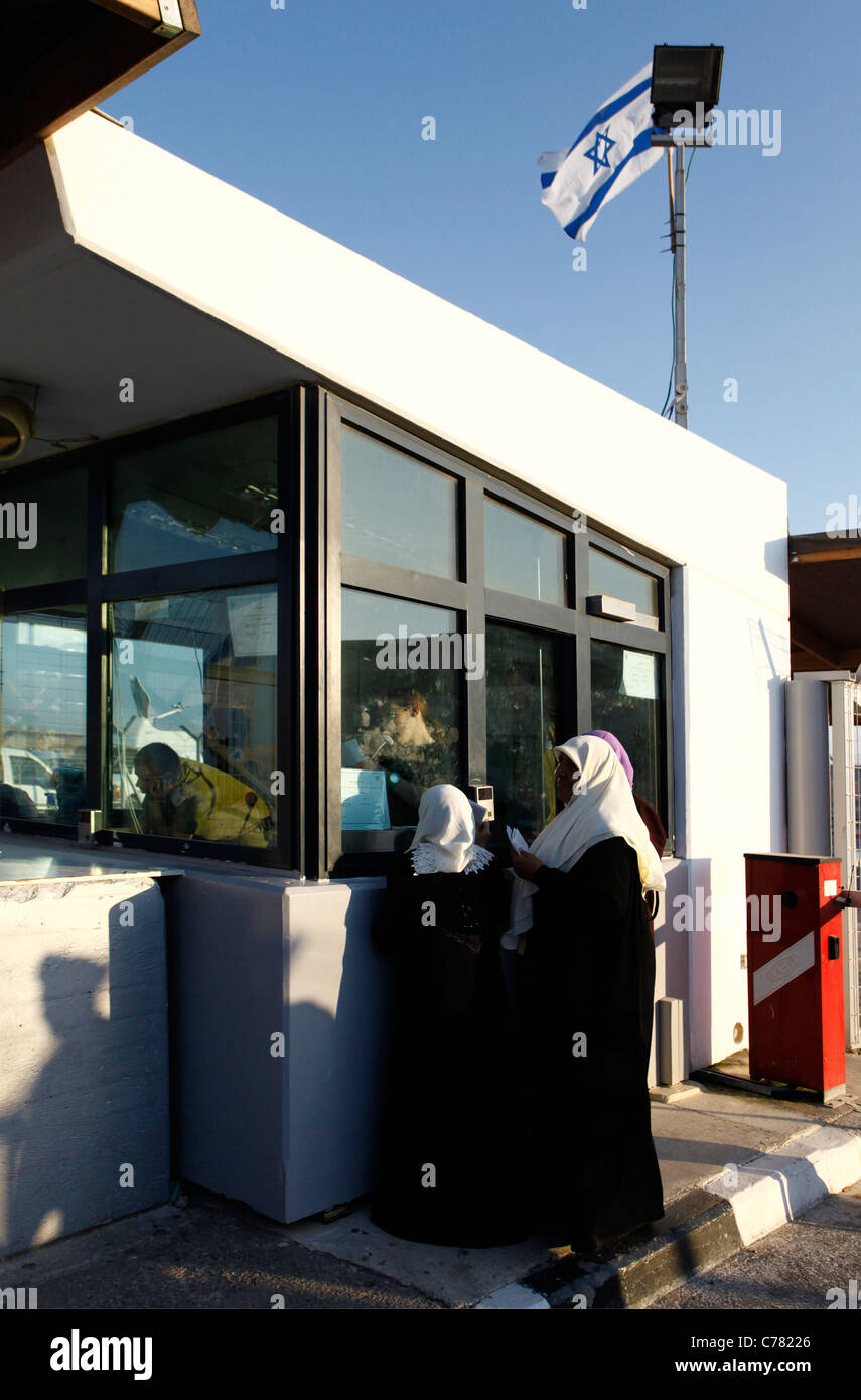 Palestinians on their way to Gaza enter the Erez border crossing also ...