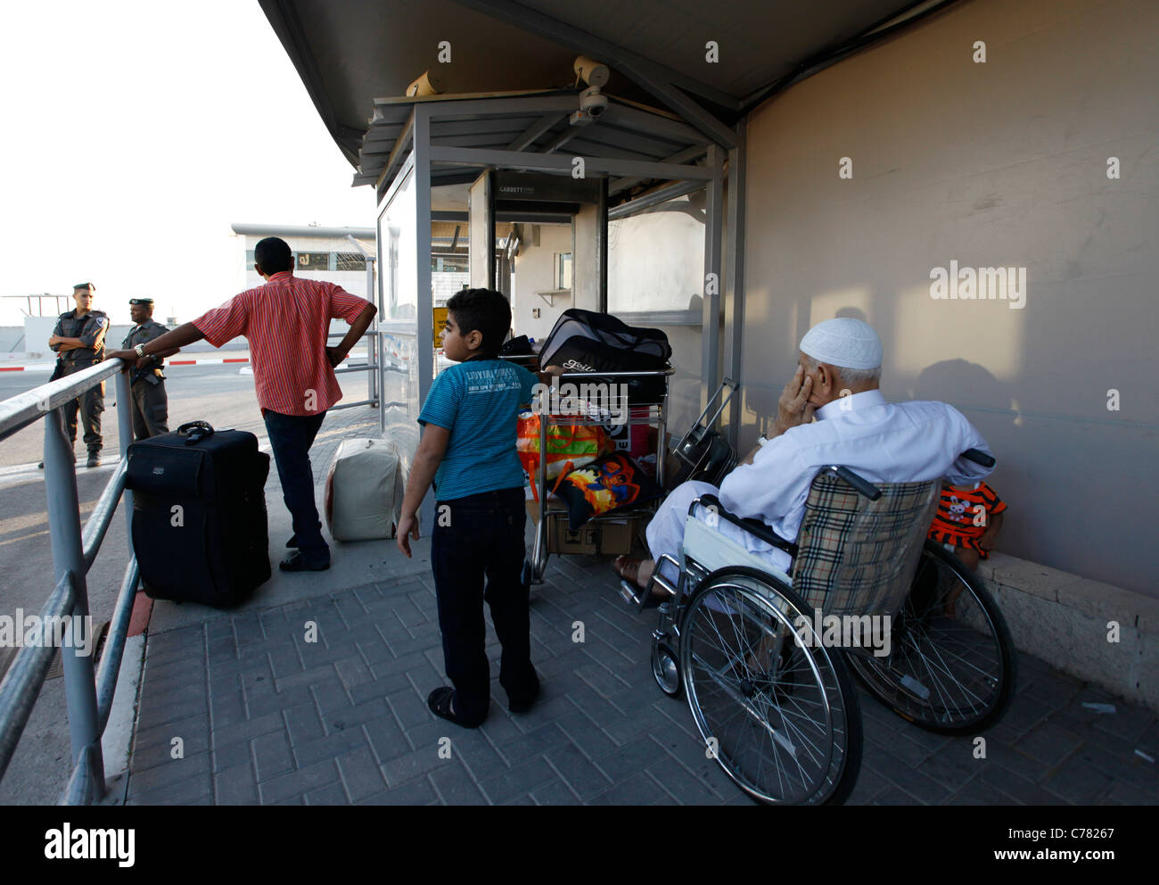 Palestinians on their way to Gaza enter the Erez border crossing also ...