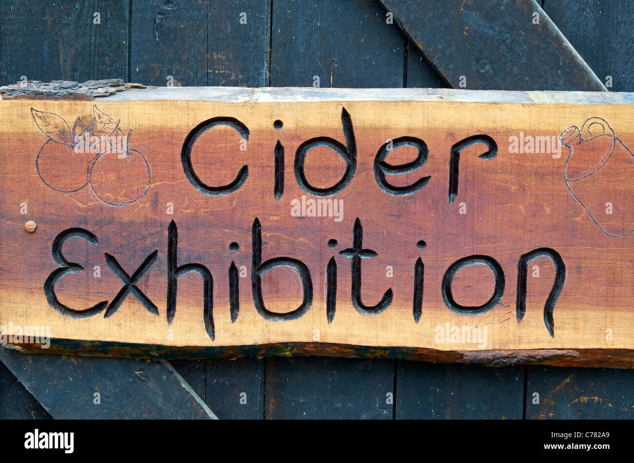 Wooden sign for a cider exhibition attached to a wooden door Stock ...