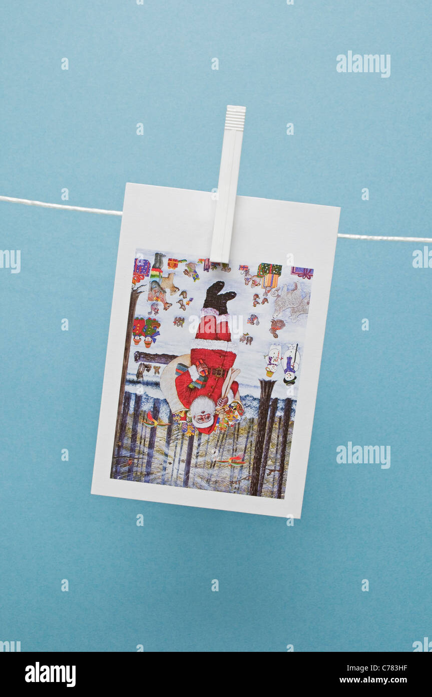 Christmas Card Hanged on Clothesline Stock Photo - Alamy