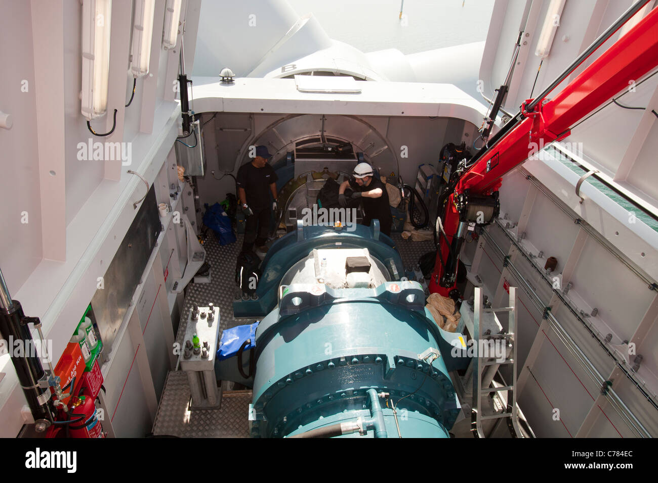 Inside Wind Turbine Engineers Working In The Nacelle Of A Wind Turbine